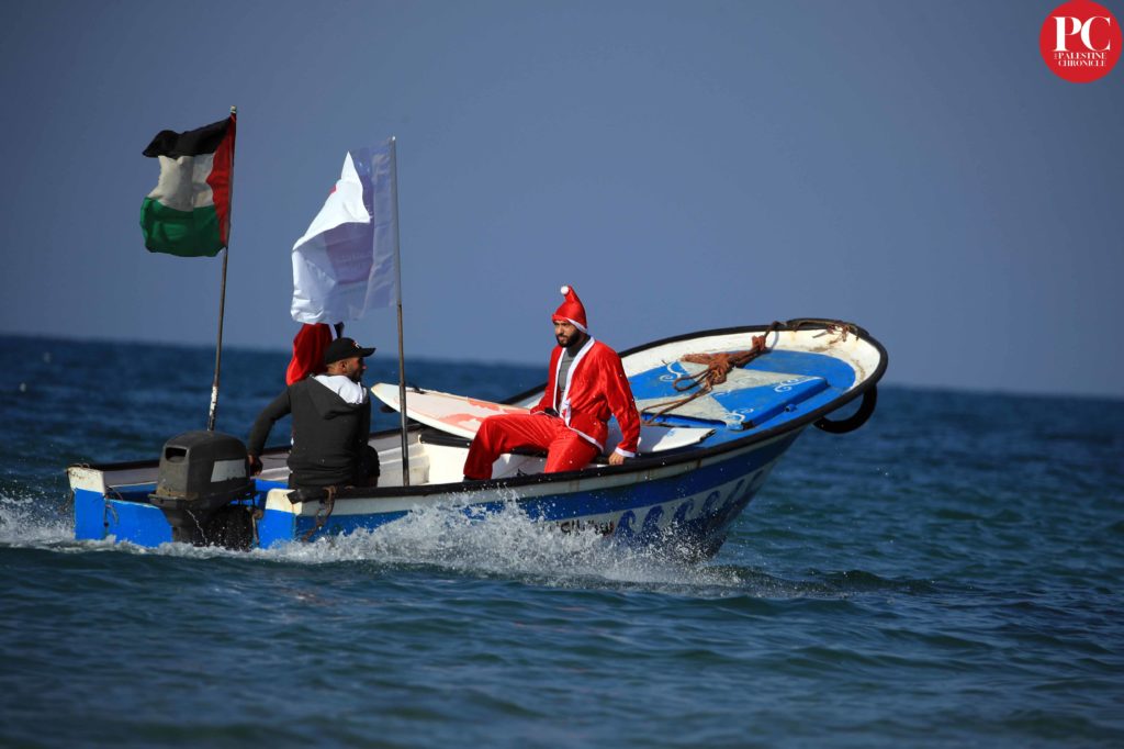 IN PHOTOS: Palestinian Santa Clauses Brave the Waves in Gaza ...